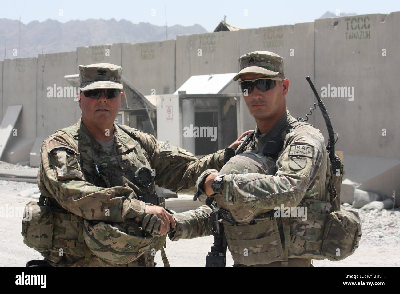 Col. Bob Hayter, left, congratulates Sgt. Zachary Leidecker upon the ...