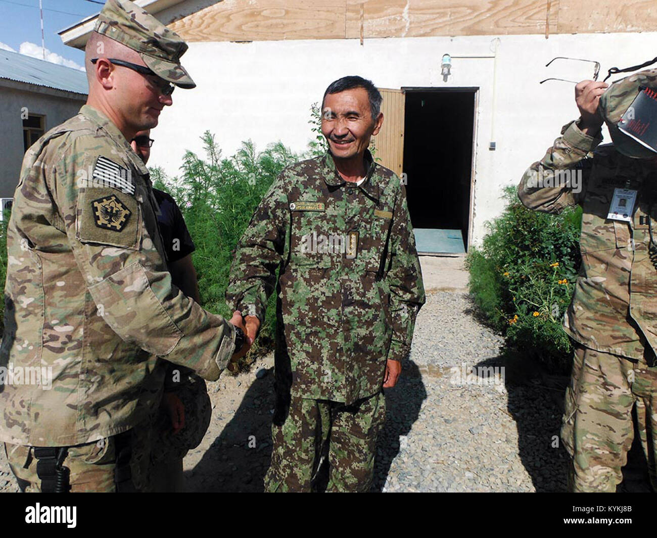 1st Lt. Mathew Doyle greets Colonel Nasrullah with the Afghan National ...
