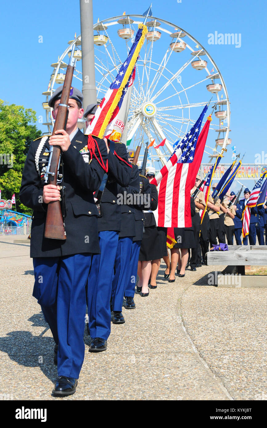 Cadets from local Junior ROTC schools present the Colors at a ceremony ...
