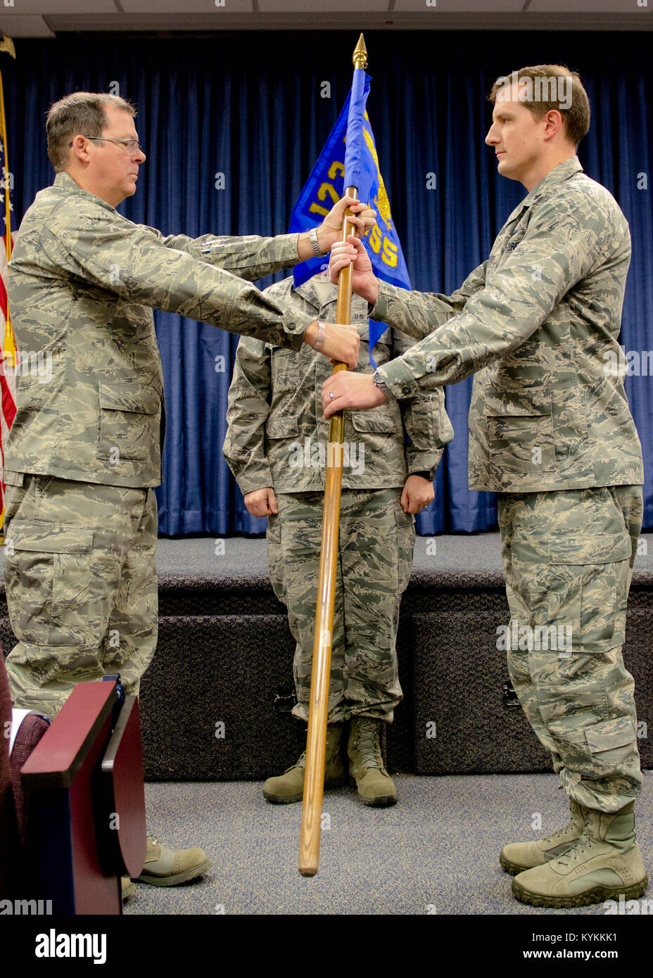 Col. Robert Hamm (left), commander of the 123rd Operations group, hands ...