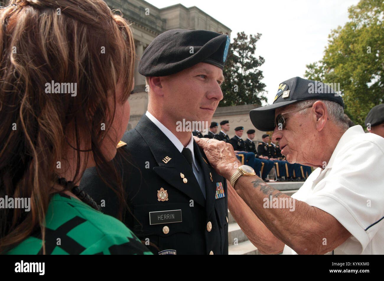Newly promoted Warrant Officer Robert A. Herrin, receives his new rank ...