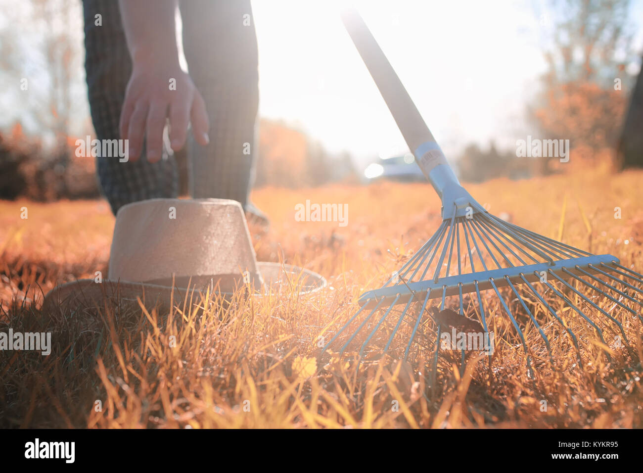 Old man raking grass hi-res stock photography and images - Alamy