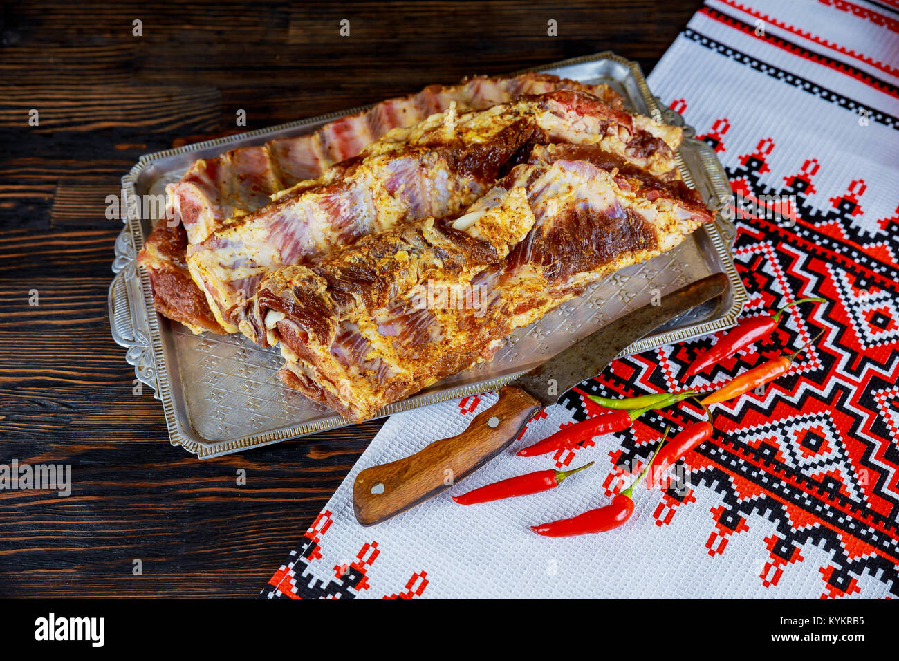 Raw lamb meat, mutton, lamb rack with fresh herbs and slices dry spices ...