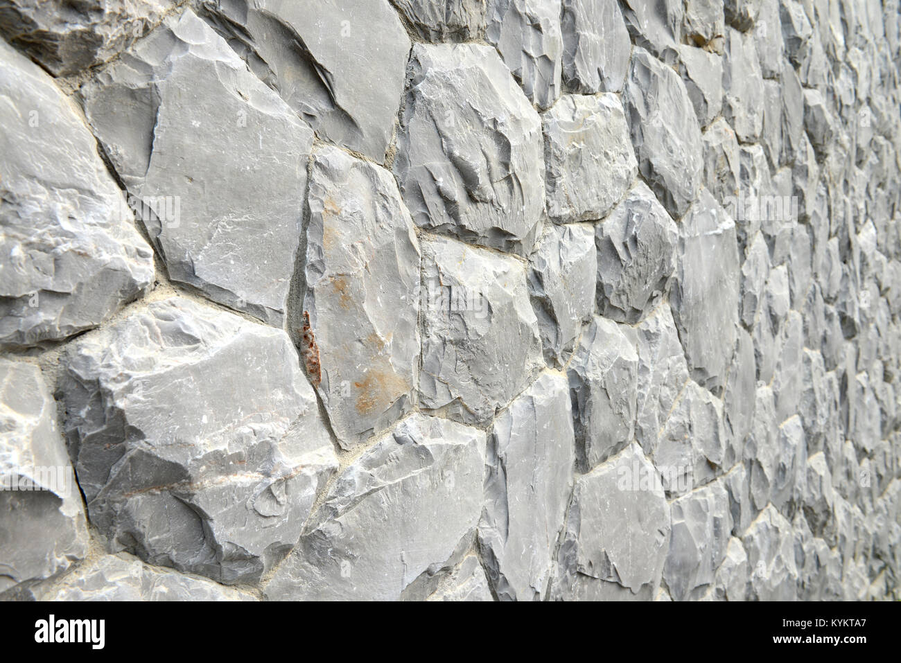Gray stone wall texture and background Stock Photo - Alamy