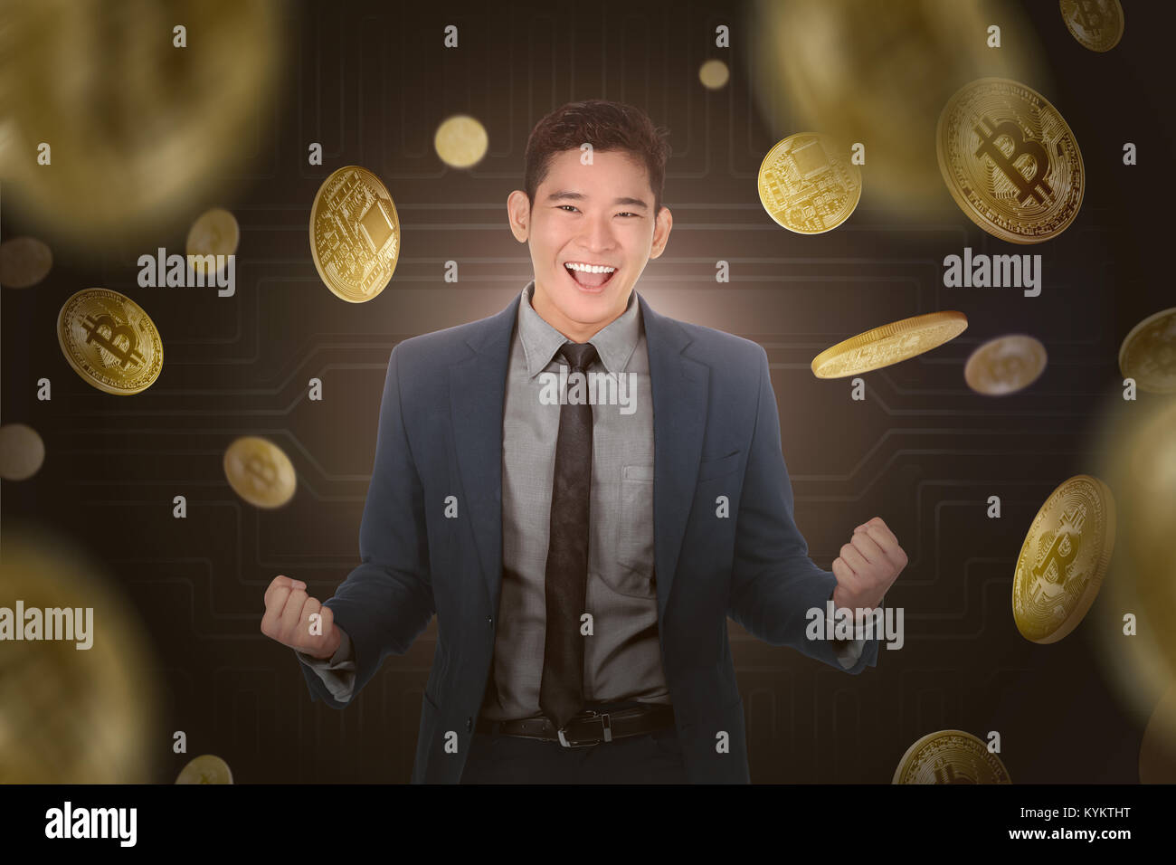 Happy asian businessman standing under a bitcoin rain against circuit ...