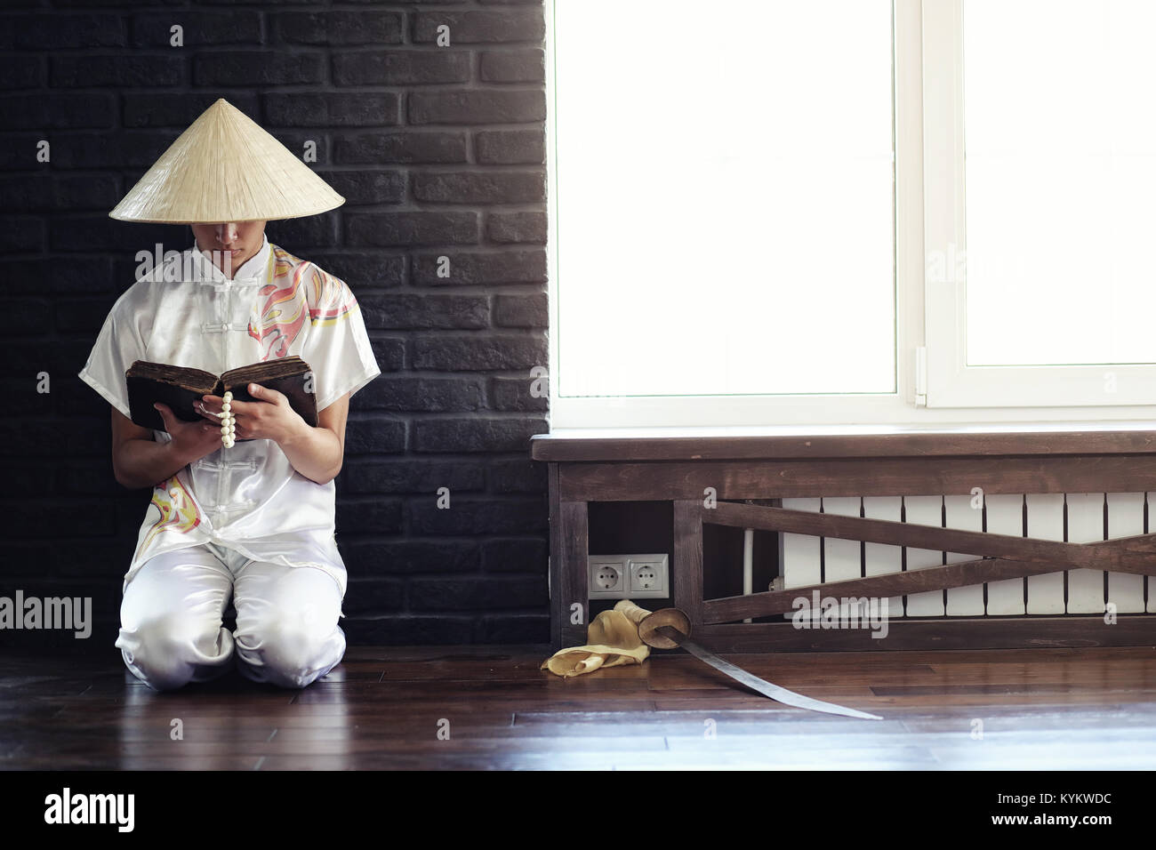 Asian monk reading an old book Stock Photo - Alamy