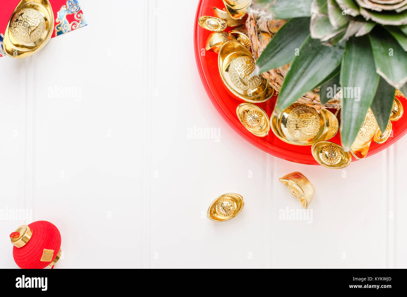 Chinese New year ang pow concept.Top view Pineapple with group of gold ...