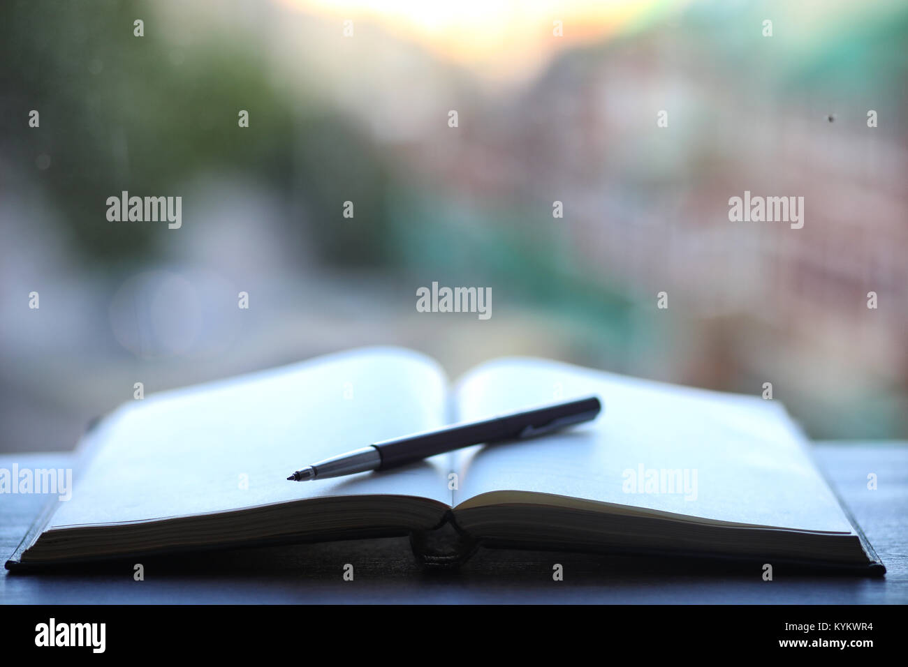 open book and a table Stock Photo - Alamy