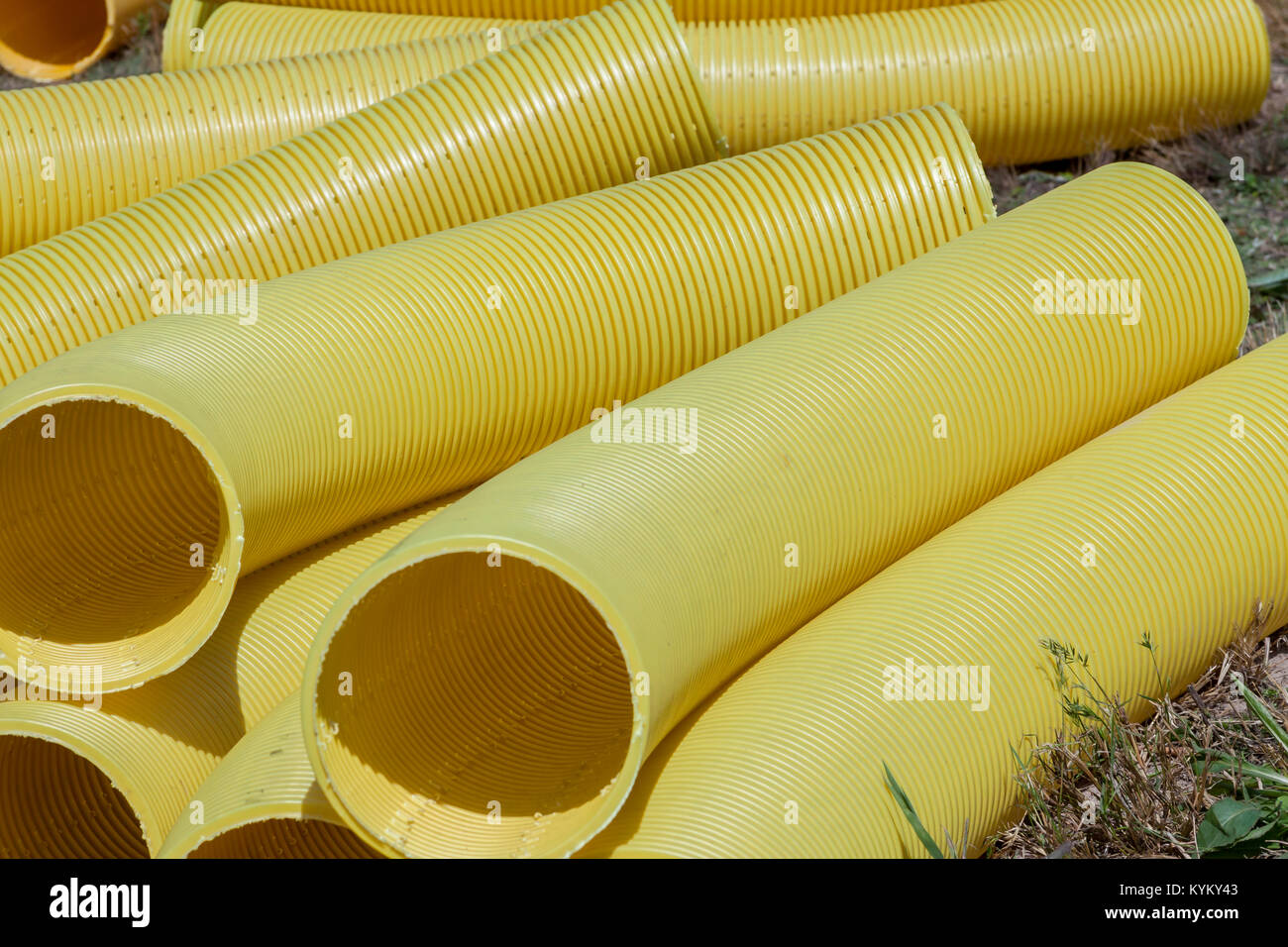 Yellow drain pipe - construction site Stock Photo - Alamy