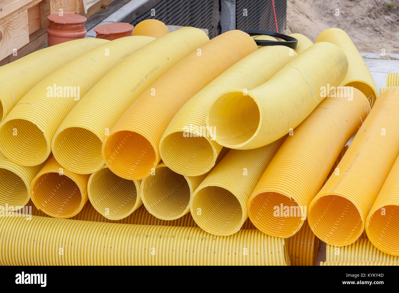 Yellow drain pipe - construction site Stock Photo - Alamy