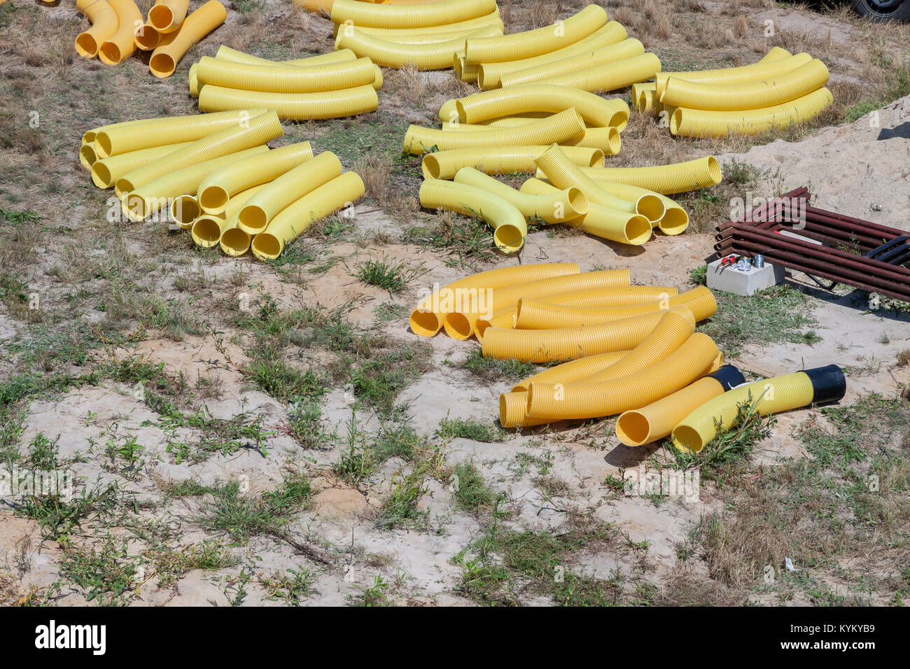 Yellow drain pipe - construction site Stock Photo - Alamy