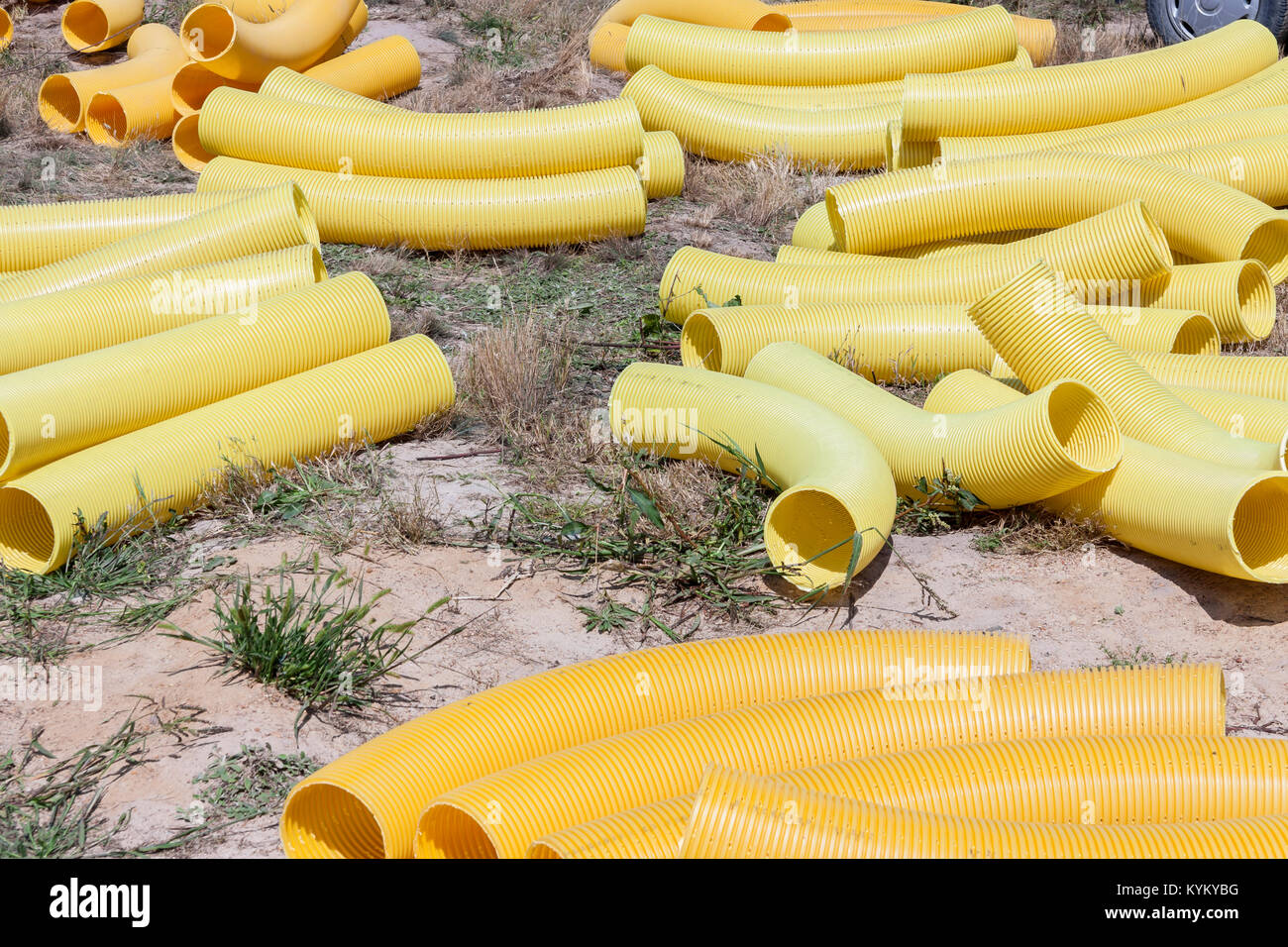 Yellow drain pipe - construction site Stock Photo - Alamy