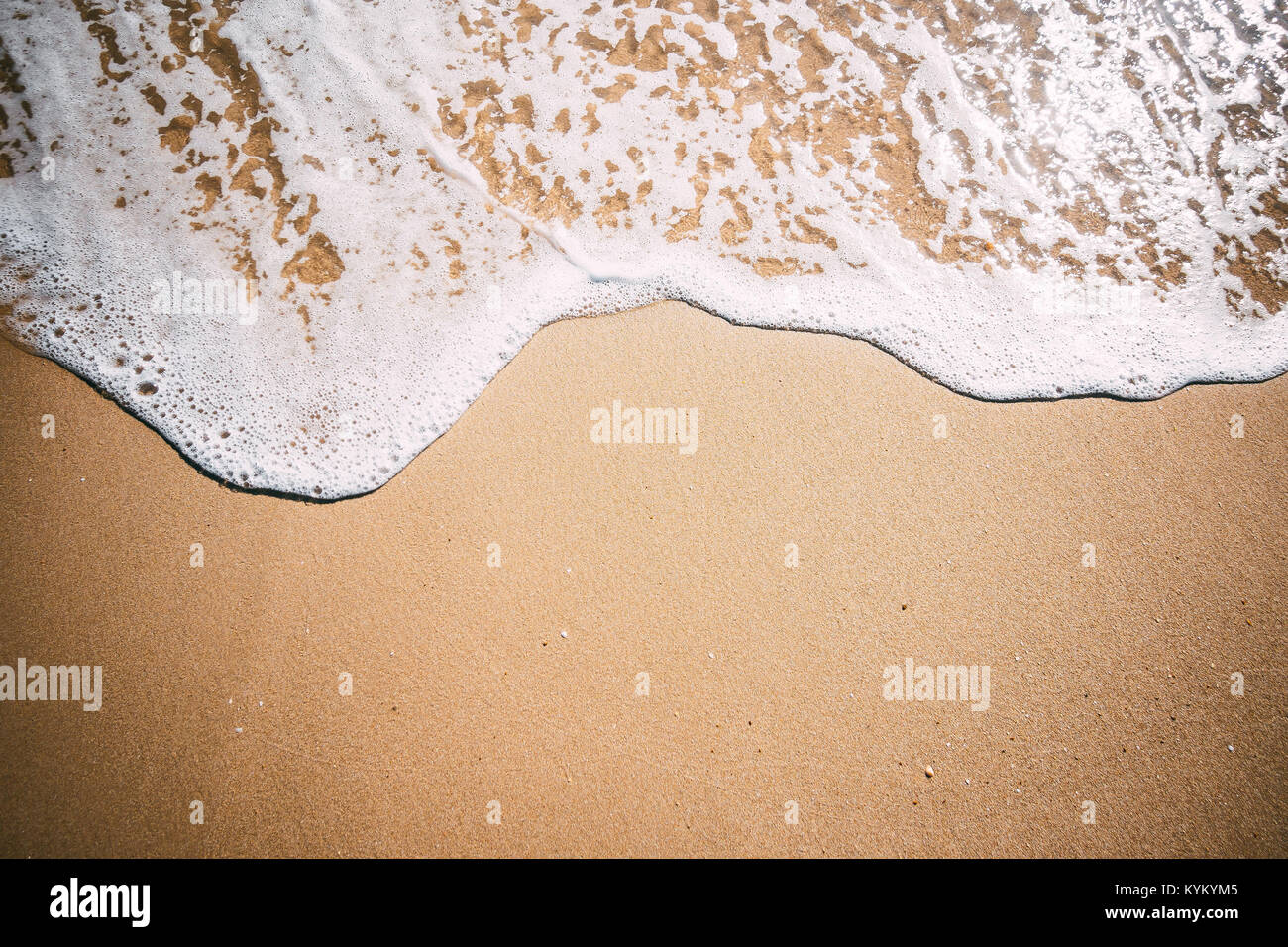 Sea background. Soft wave of blue sea on sandy beach Stock Photo - Alamy