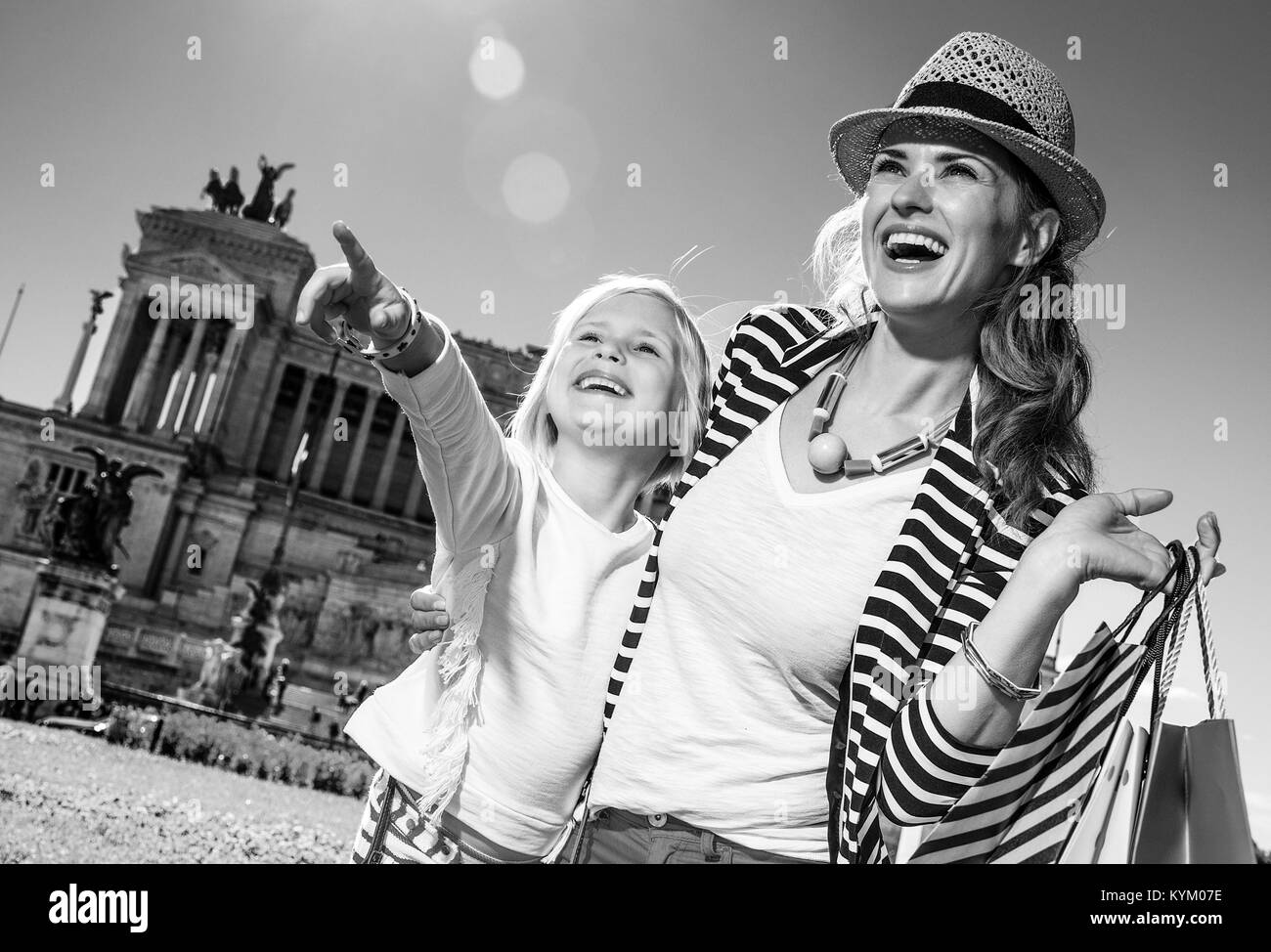 Roman Holiday. smiling modern mother and daughter travellers against ...