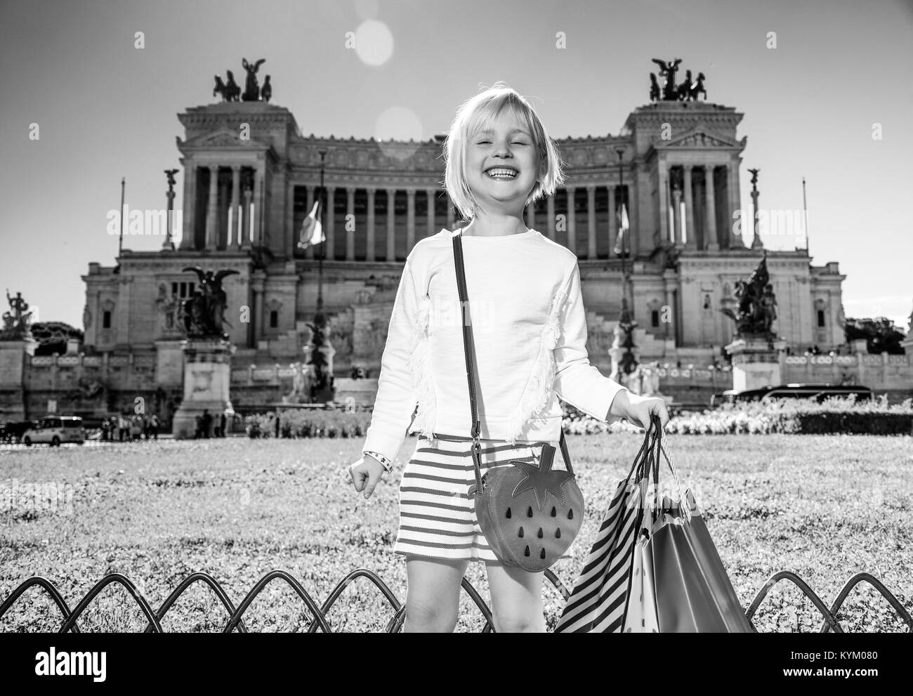 Roman Holiday. Portrait of happy modern girl in the front of Palazzo ...
