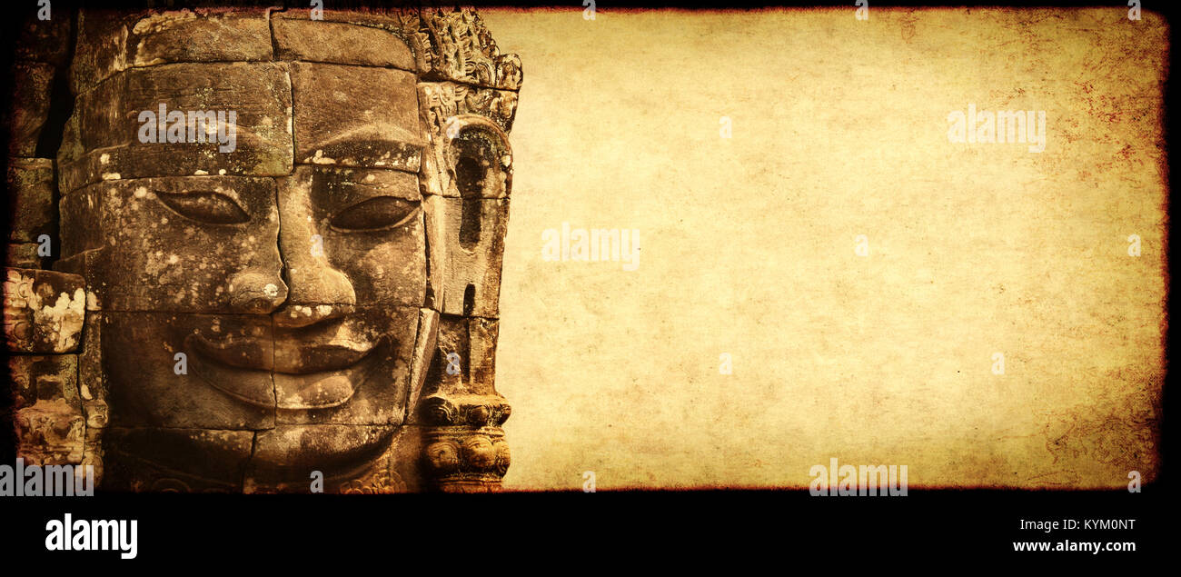 Grunge background with paper texture and giant stone face in Prasat ...