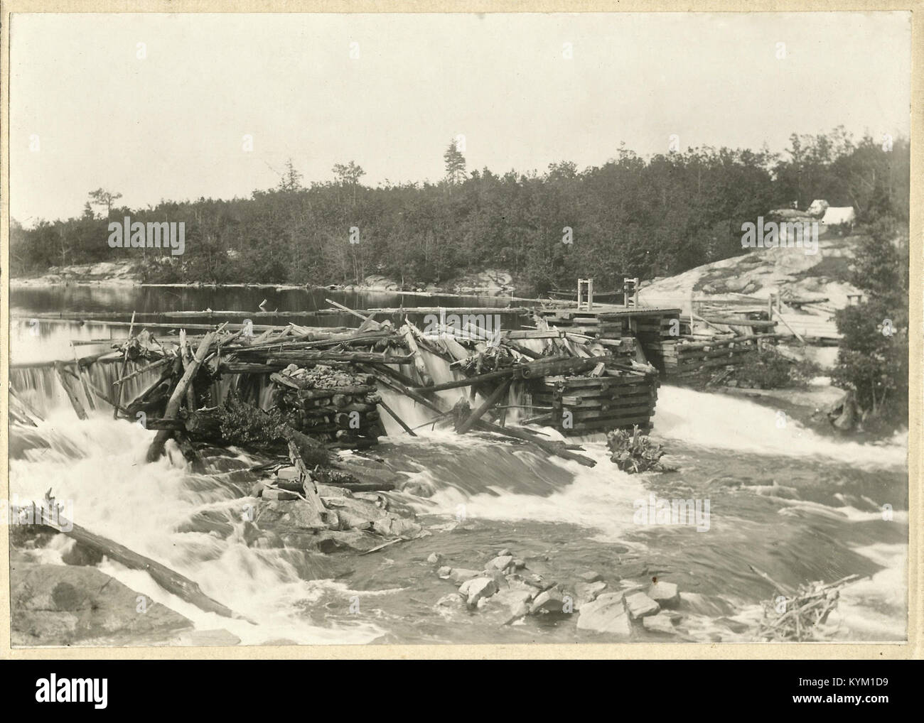 A historic photograph of the Upper Ragged Chutes Dam, capturing its ...