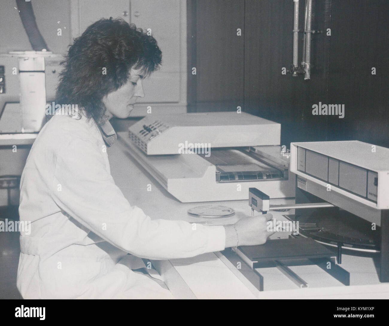 SMT Engineer Eileen Gould assembling a prototype SMT board. The image ...