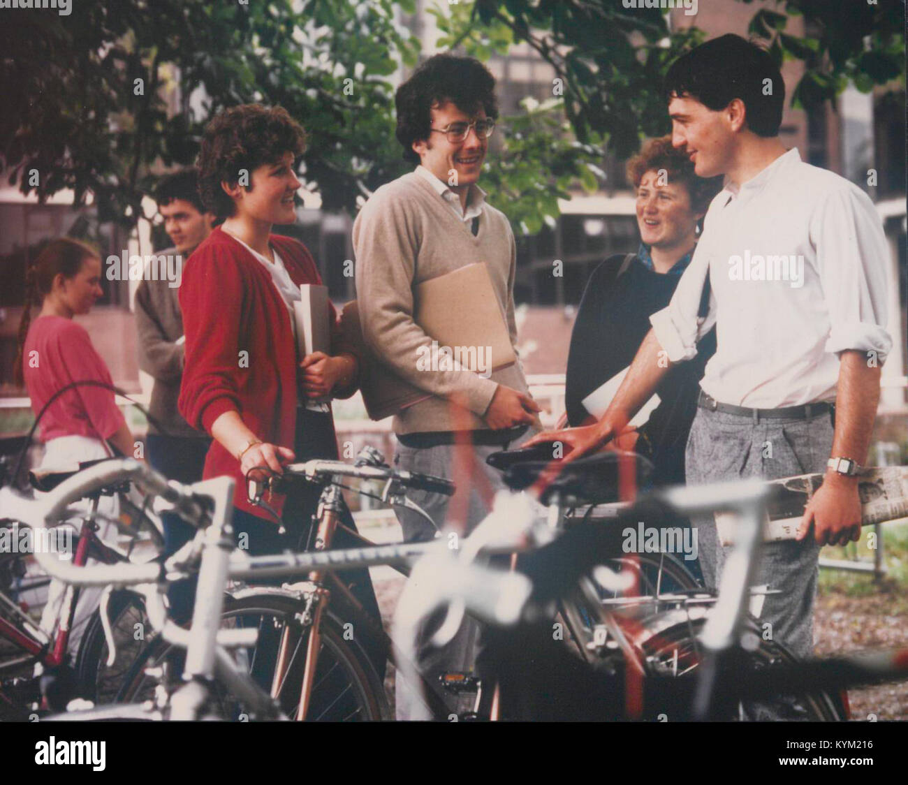The image captures a group of students on the campus of the University ...