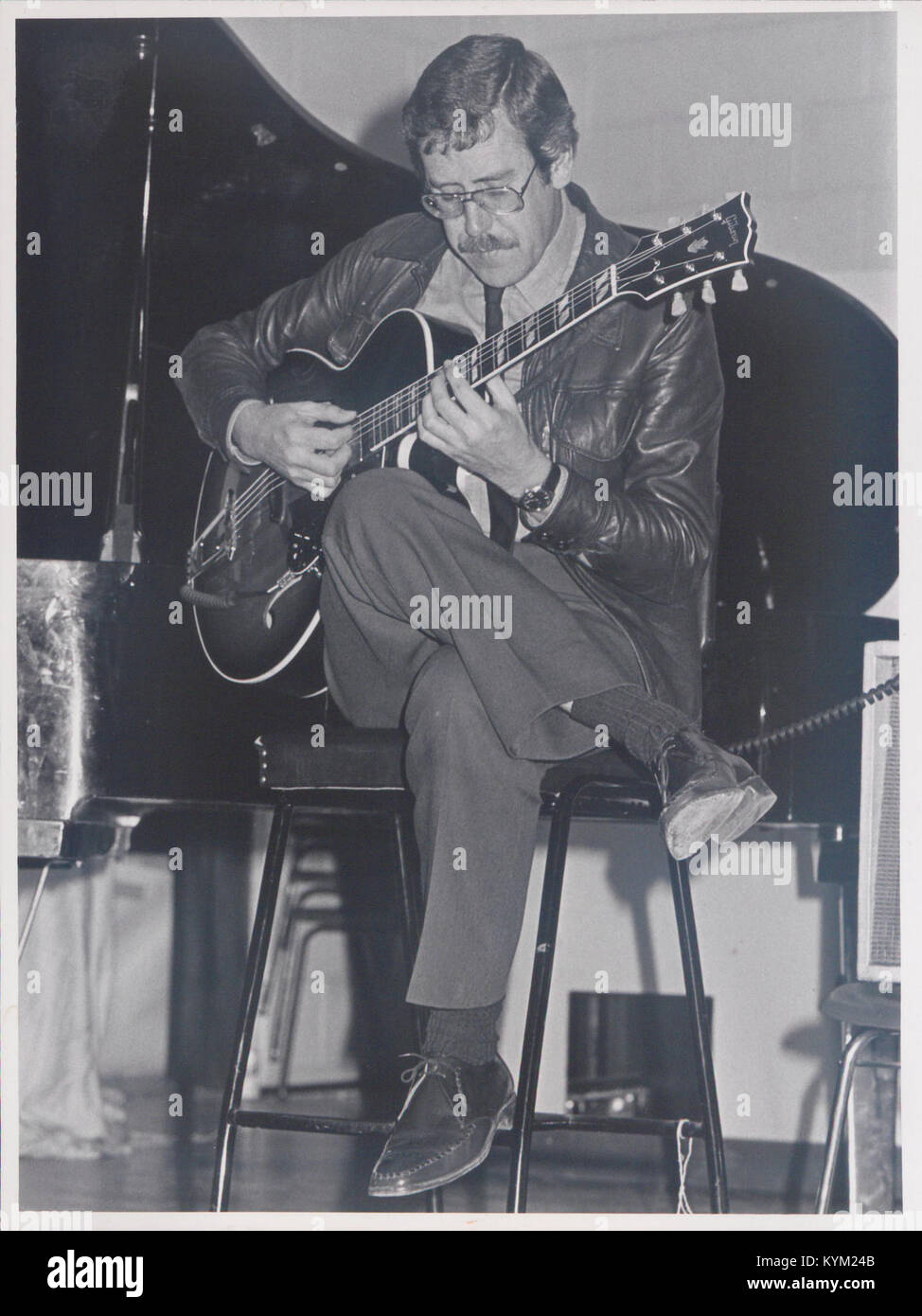 Louis Stewart, a renowned jazz guitarist, captured playing his ...