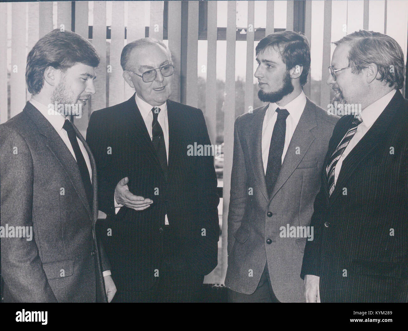 A photograph of George Waters delivering a lecture titled 'The ...