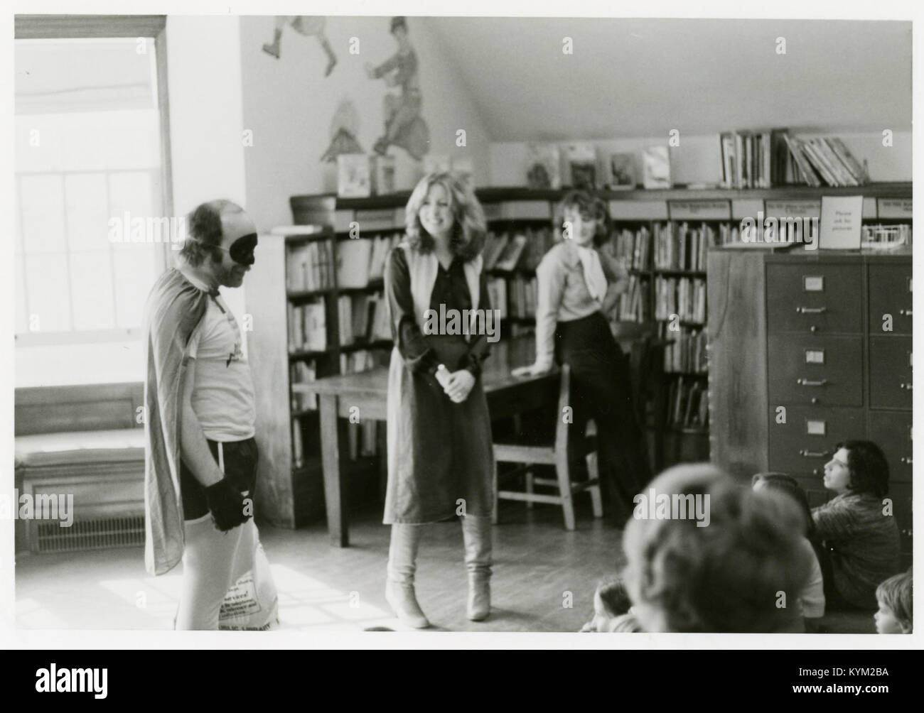 A photograph capturing a librarian conducting storytime at the ...