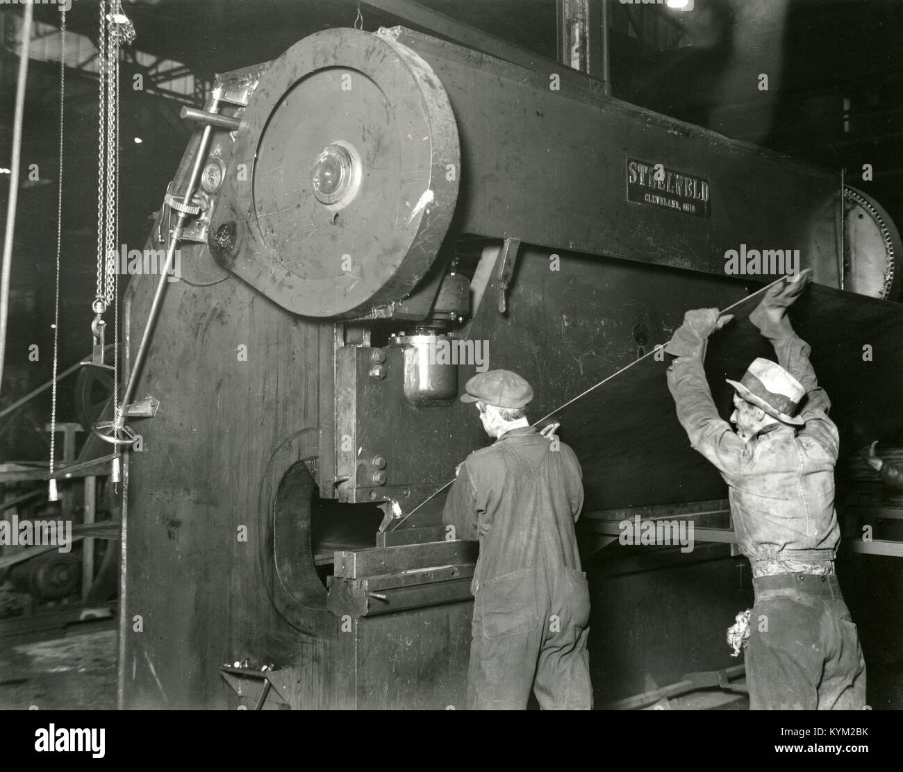 This image captures workers at Stelco, a major steel manufacturing ...