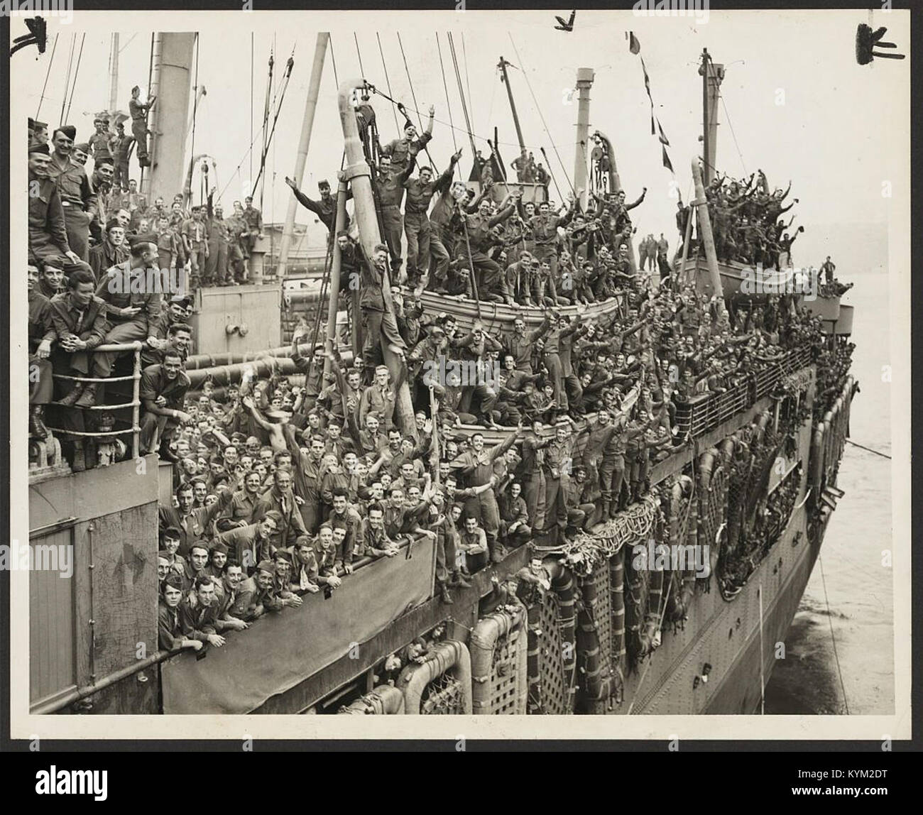 A historical photograph depicting troops of the 20th Armored Division ...