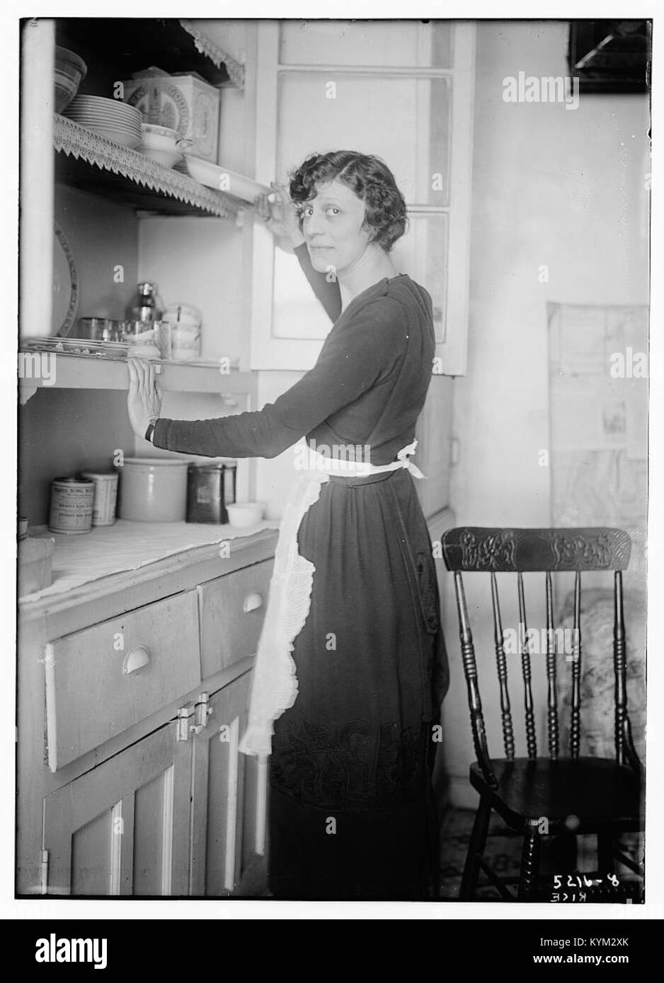 A historical photograph of rice production or harvesting, captured by ...