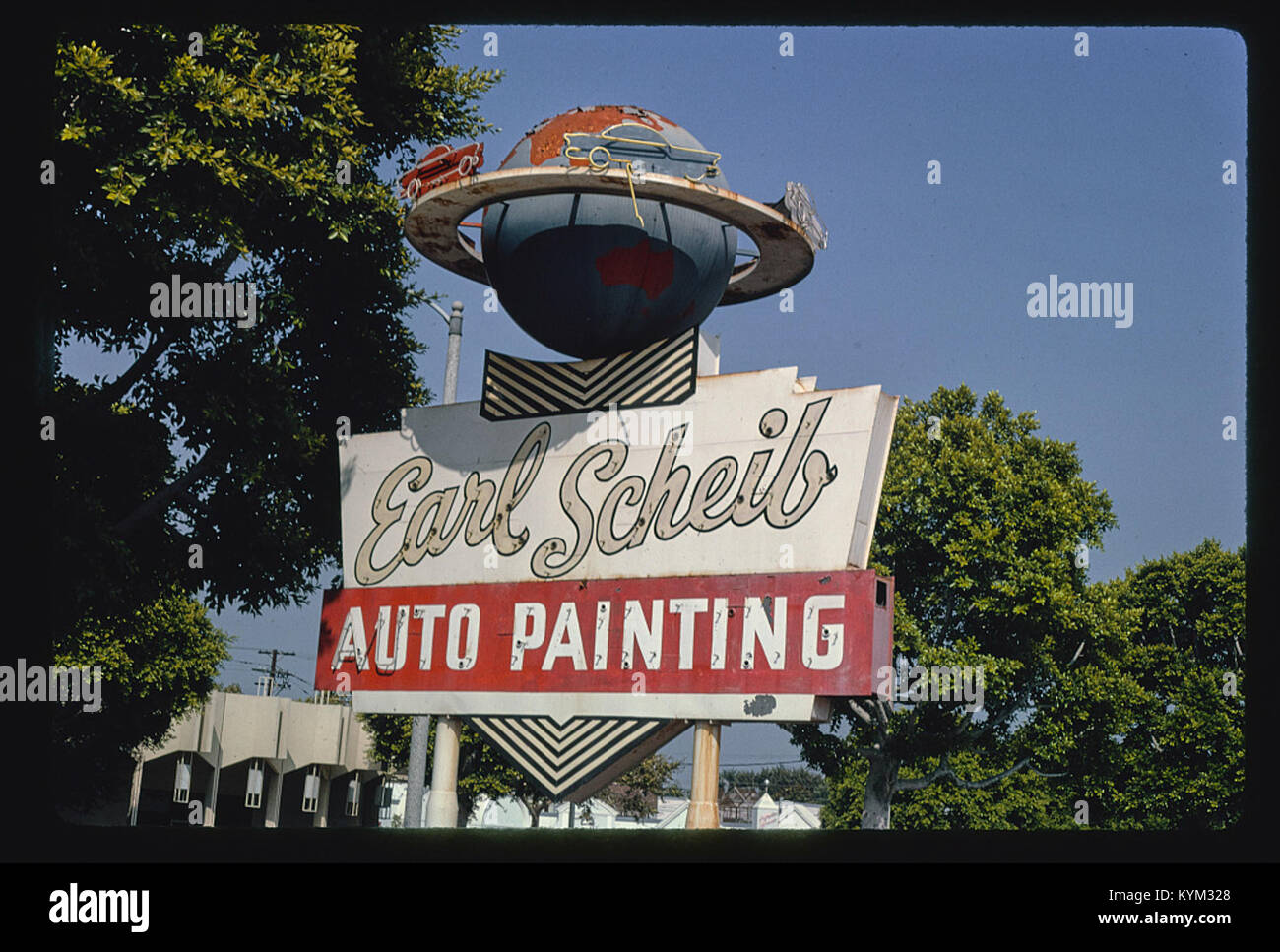 A photograph of the upper detail of an Earl Schieb Auto Painting sign ...