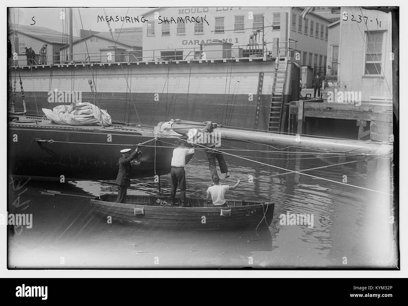 A historical photograph depicting the measuring of the SHAMROCK, a ...