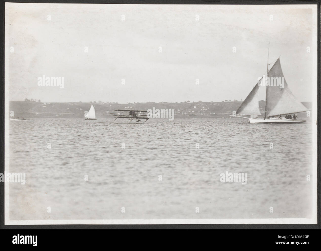 Photograph of the Curtiss Pusher biplane in flight over San Diego Bay ...