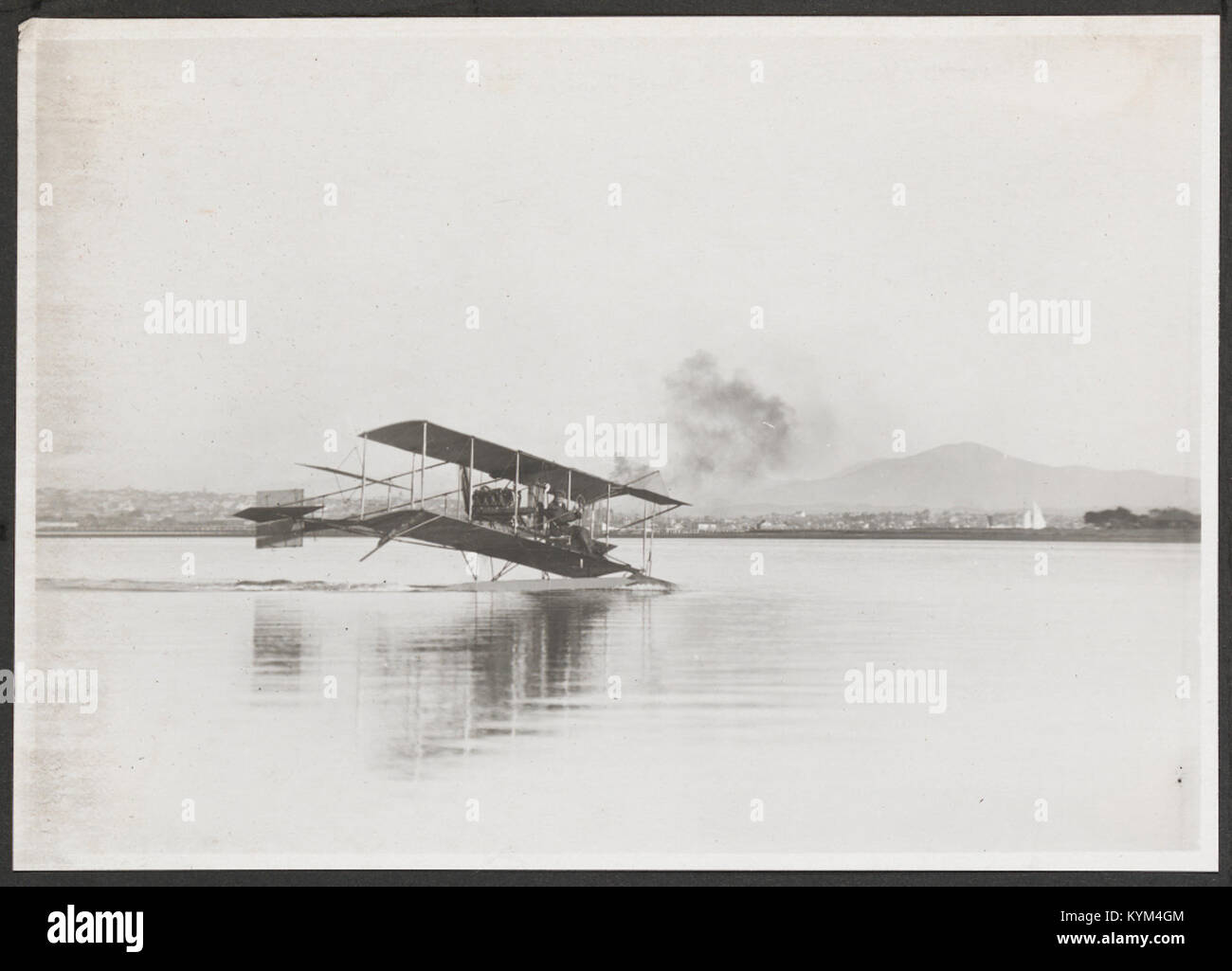 A historic image of Glenn Curtiss in his Curtiss Pusher floatplane, an ...