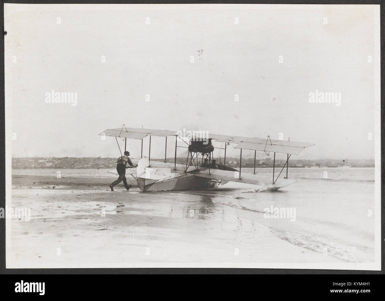 An image of the Curtiss Model F seaplane on the shoreline, a biplane ...