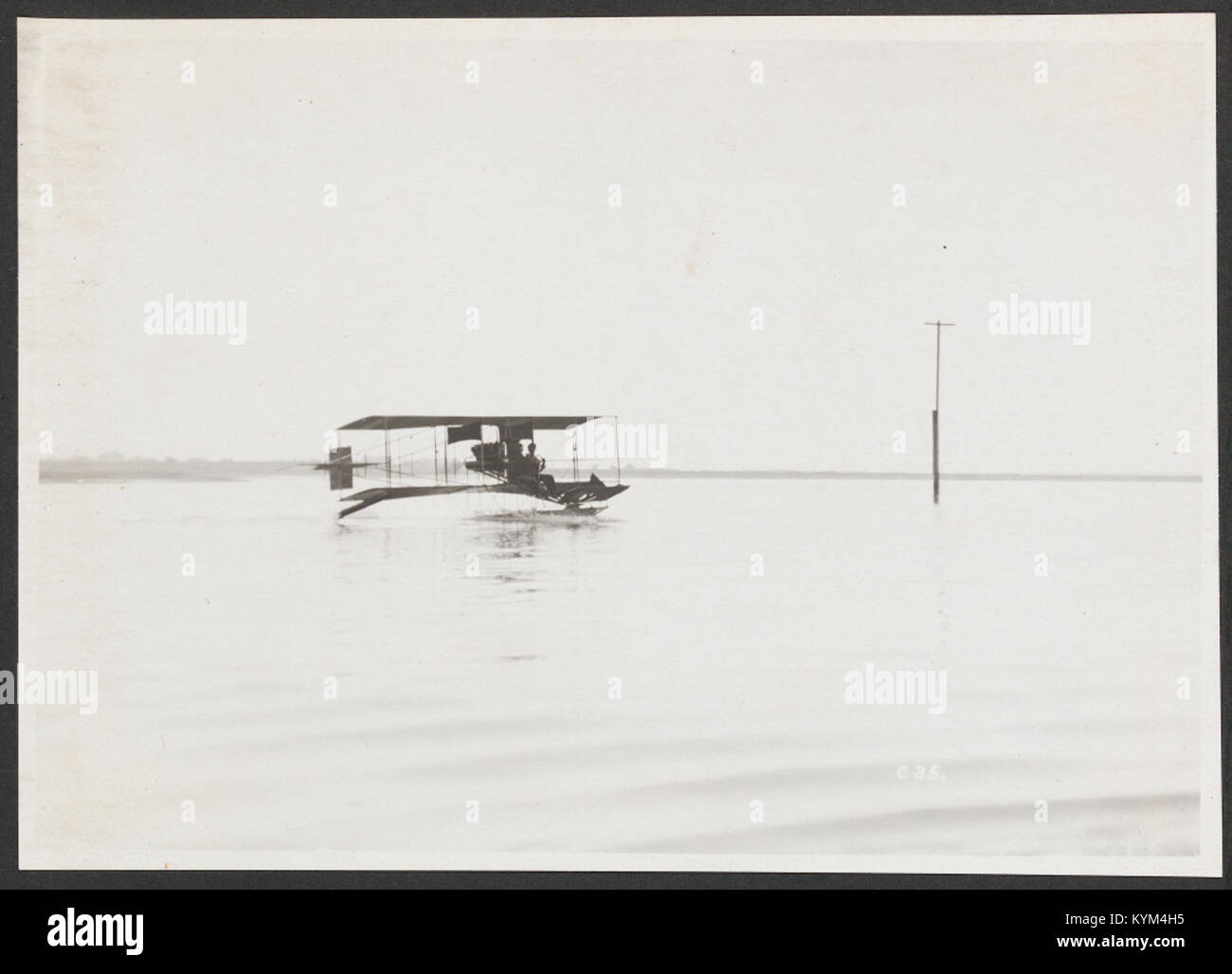 A Curtiss Dual Control Floatplane shown in flight, an early biplane ...