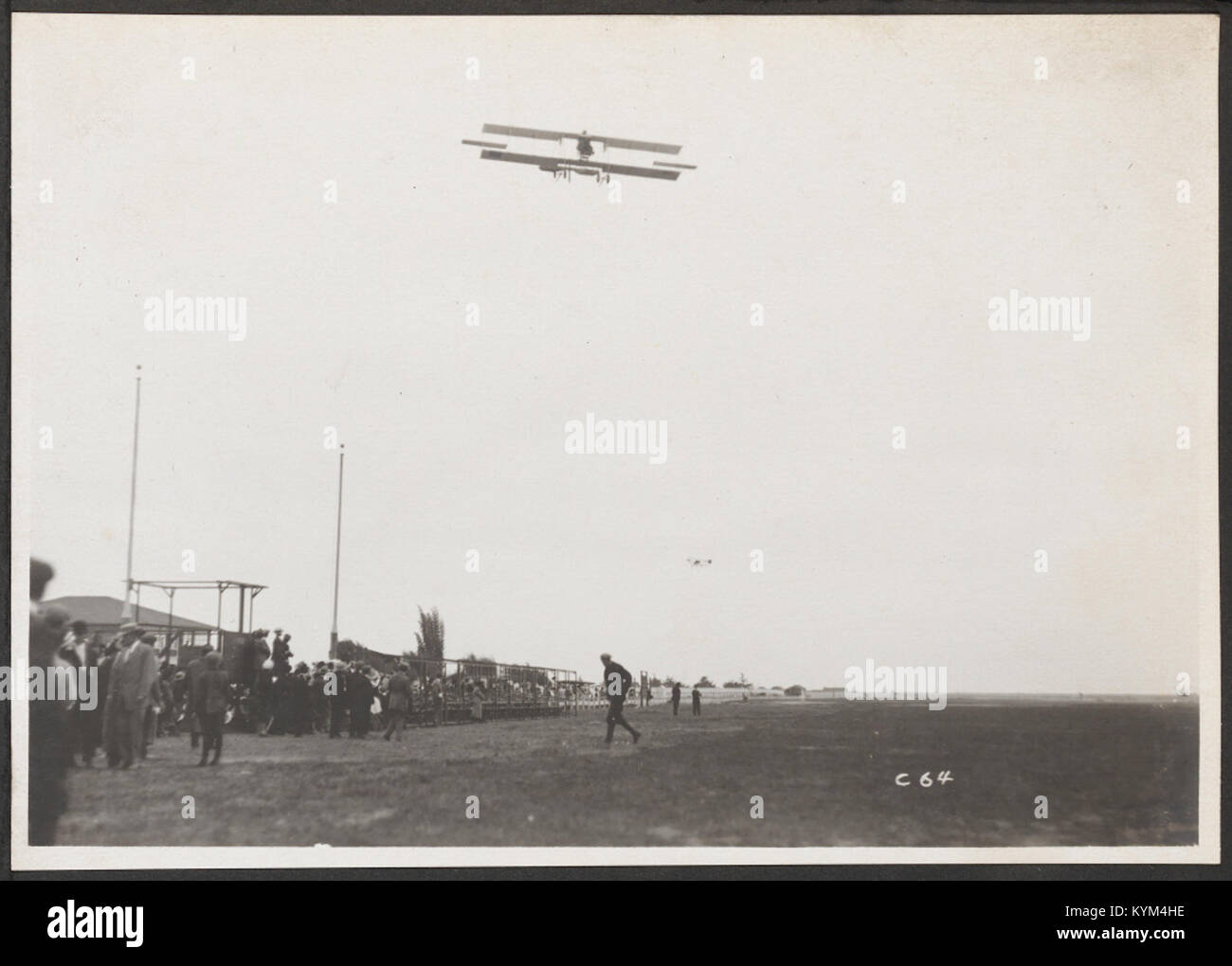 Photograph of a biplane flying over a crowd at the Coronado Country ...