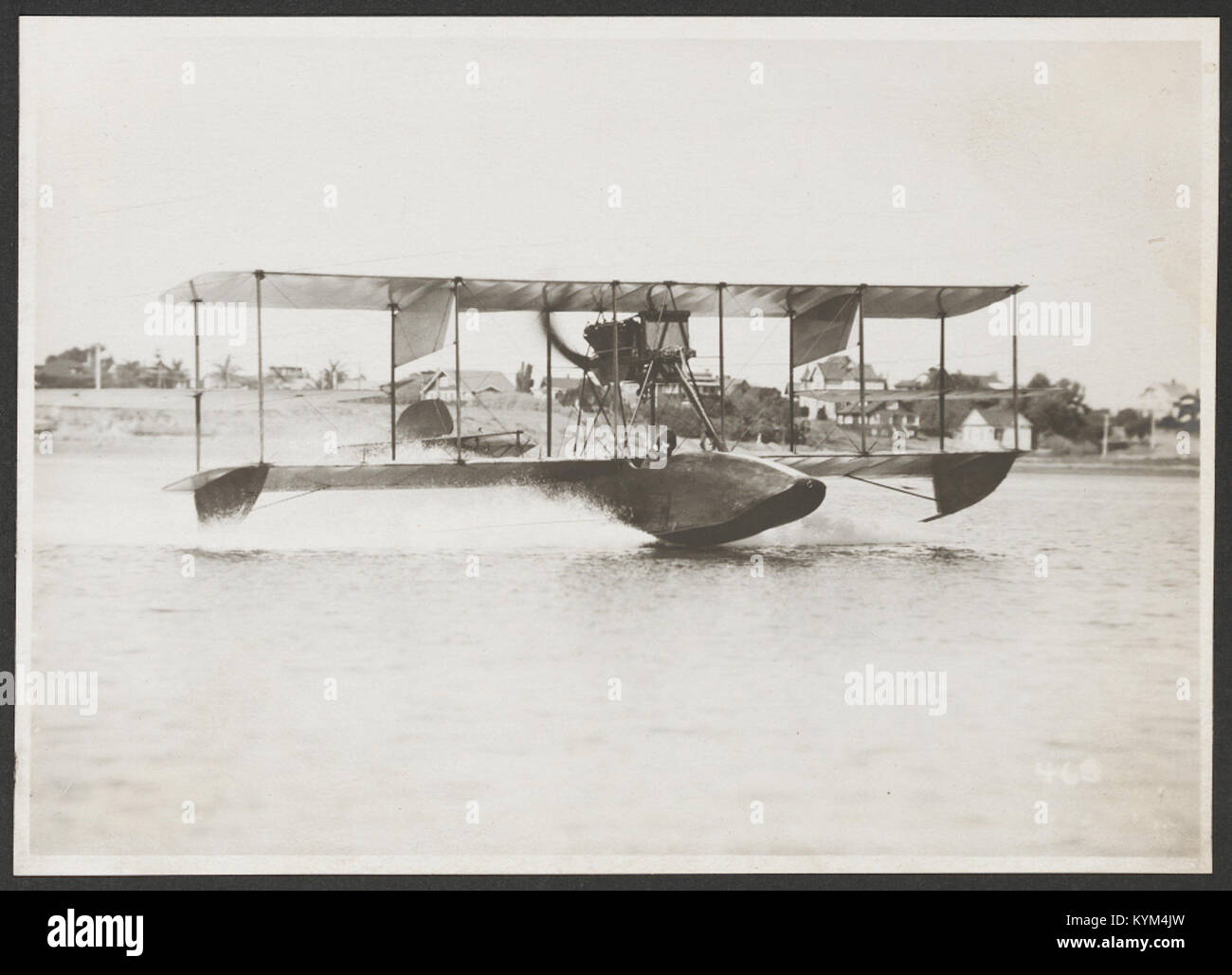 A Curtiss F-Boat, an early biplane flying boat, captured in flight ...