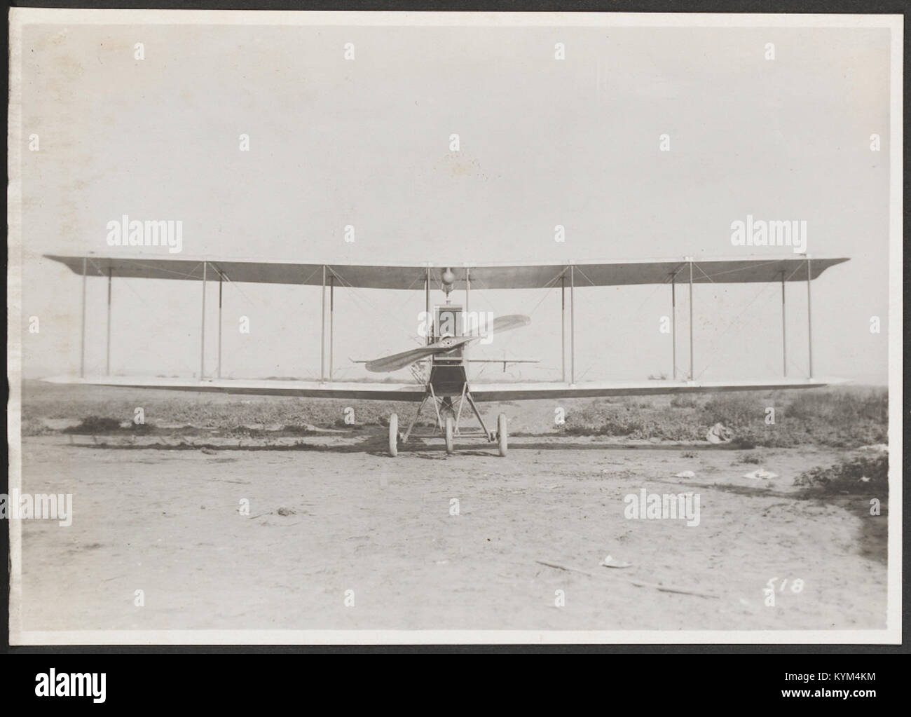 This front view of an early biplane captures the vintage design and ...