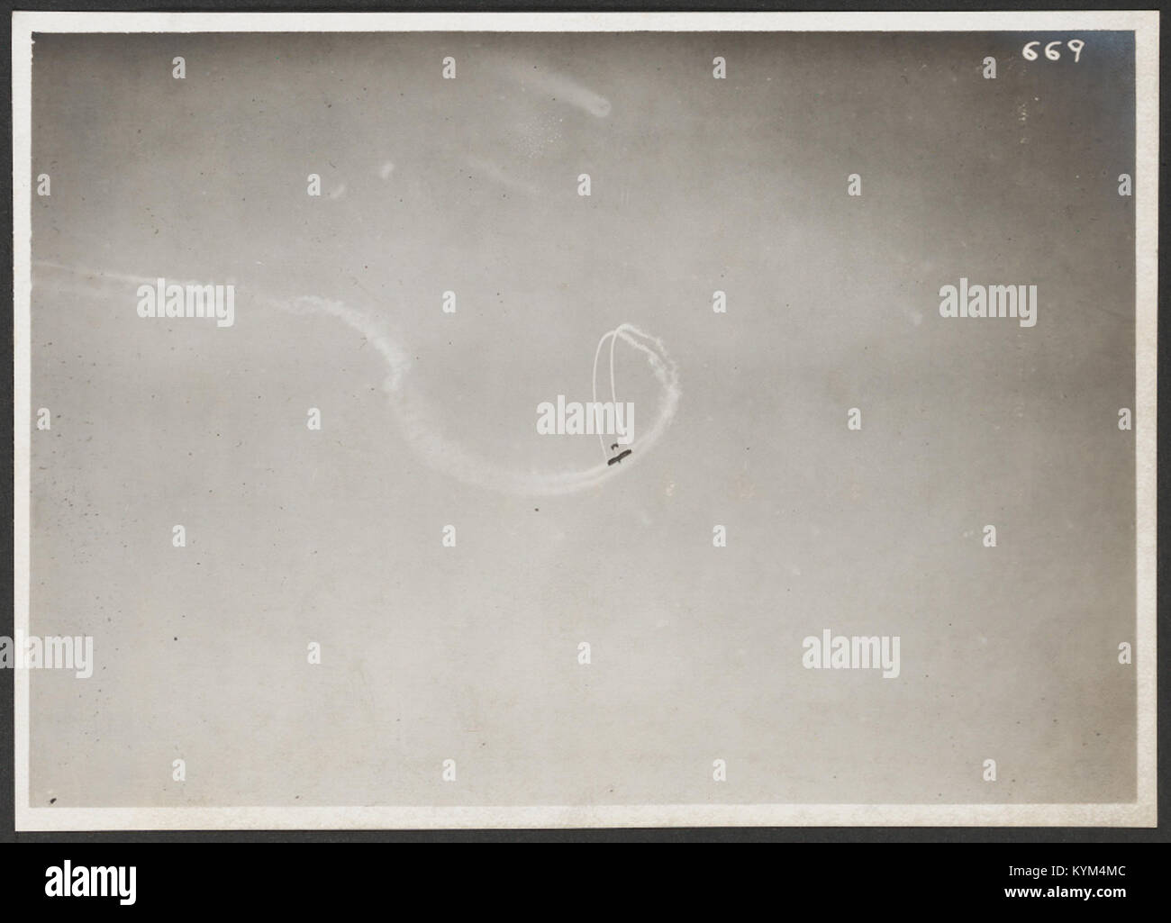 A photograph capturing stunt flying maneuvers by an aviator, showcasing ...