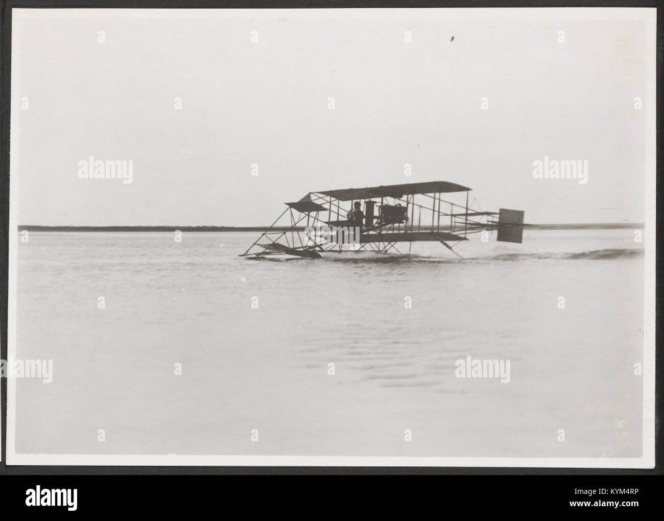 Glenn Curtiss flying his floatplane in 1911. This image captures one of ...