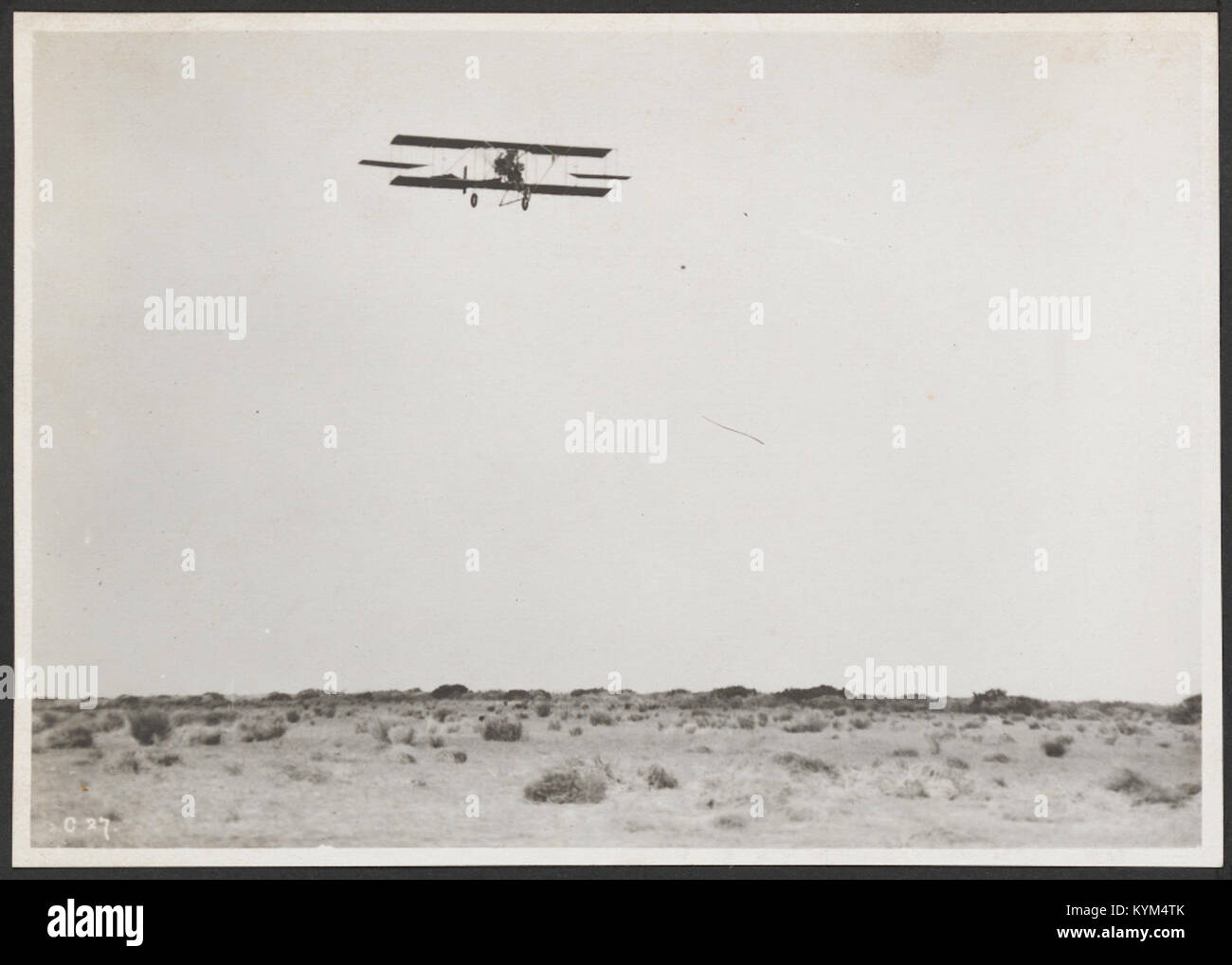 The Curtiss Pusher is shown in flight over North Island, San Diego, in ...