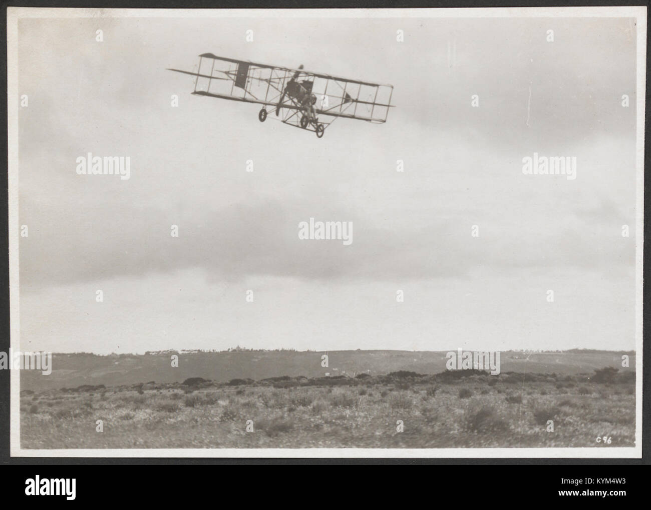 A photograph of a Curtiss Pusher biplane in flight over North Island ...
