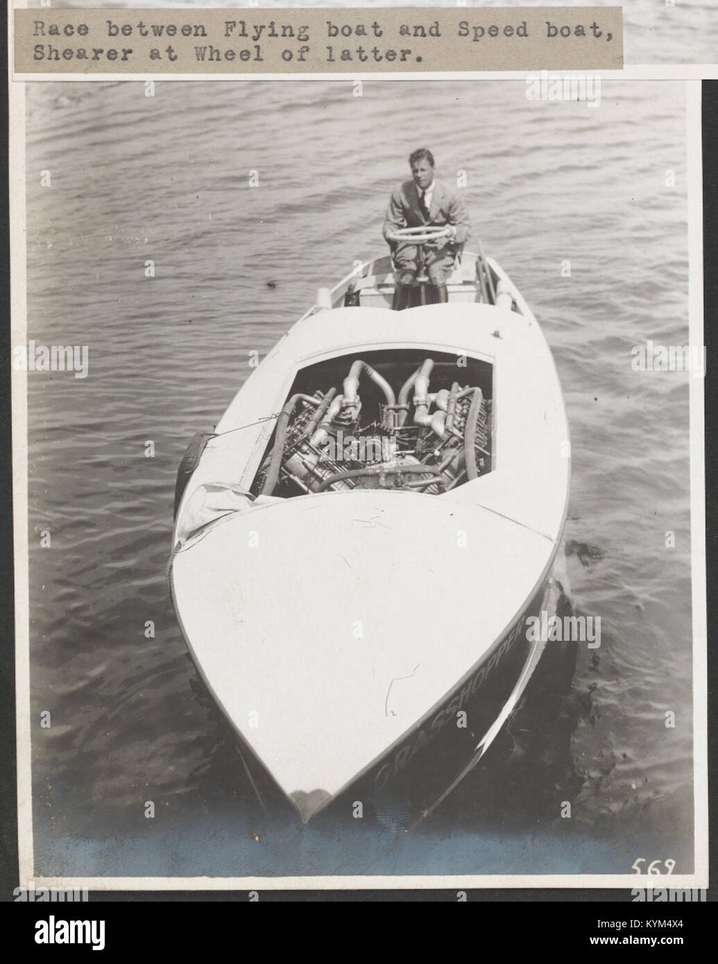 A photograph capturing Shearer at the controls of a speedboat ...