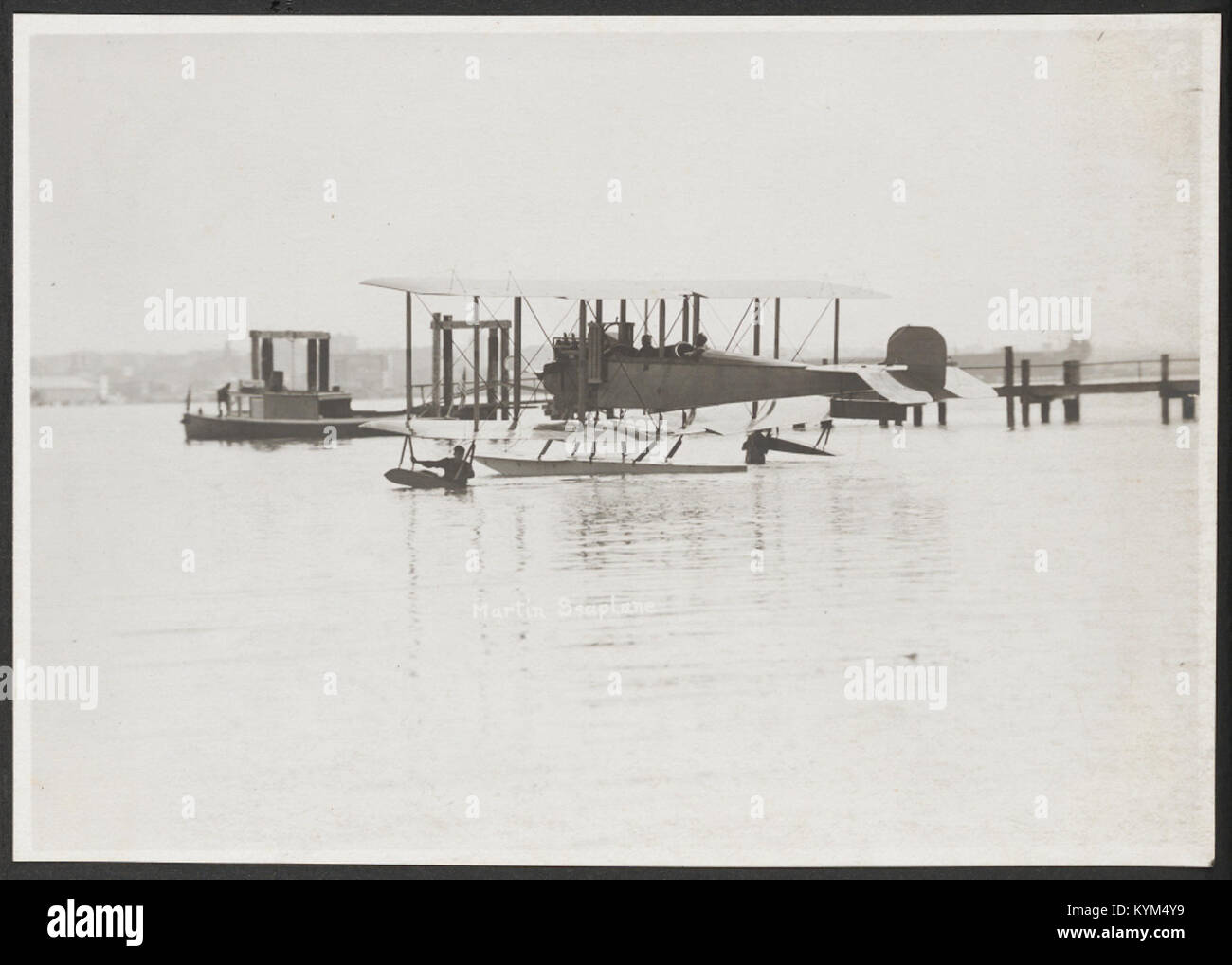 #A photograph of a Martin seaplane in flight, showcasing early aviation ...