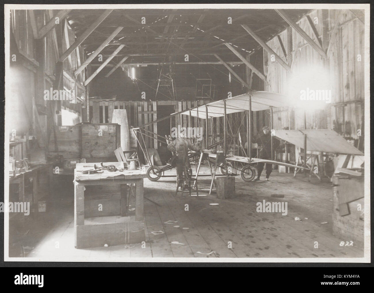 A Curtiss Pusher biplane inside a hangar, captured in early aviation ...