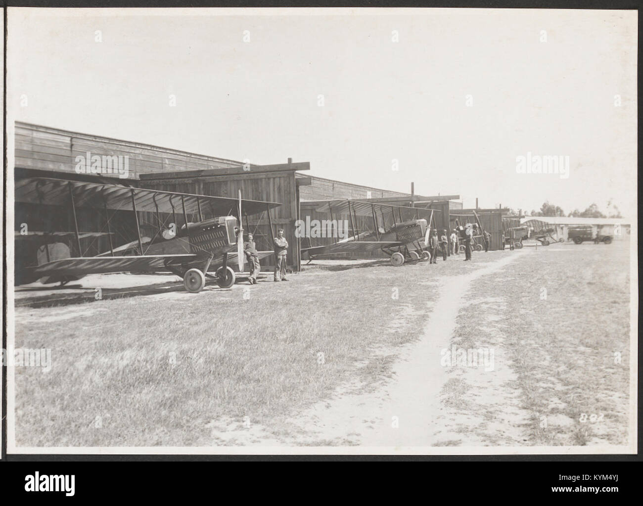 A historical image showing Martin TT Biplanes outside their hangars ...
