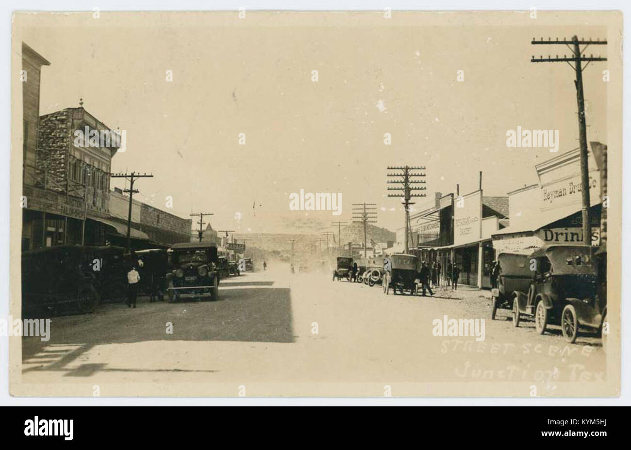 A historical street scene in Junction, Texas, captured in an early 20th ...