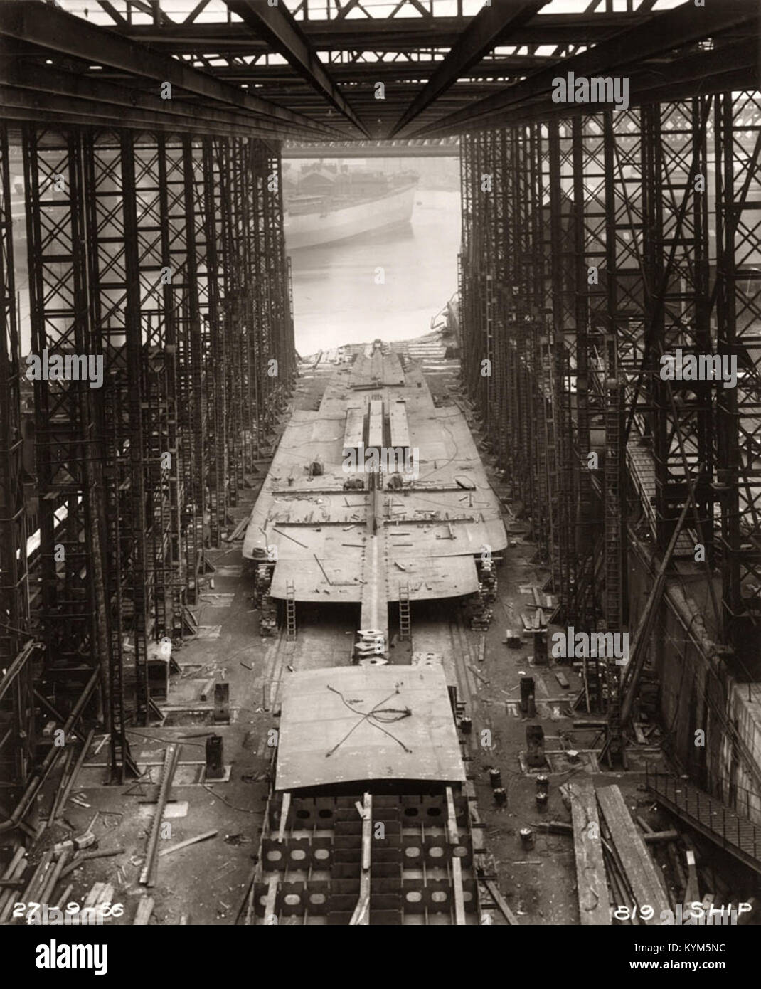 A historical photograph showing the continued construction of the hull ...