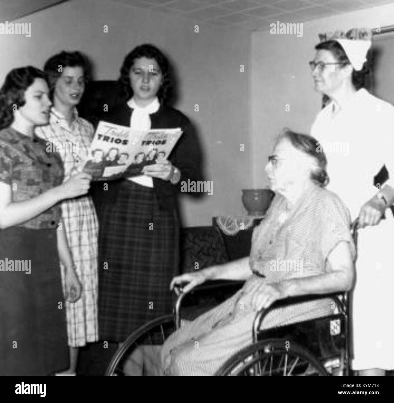 Photograph of girls singing to a patient at a facility in La Junta ...