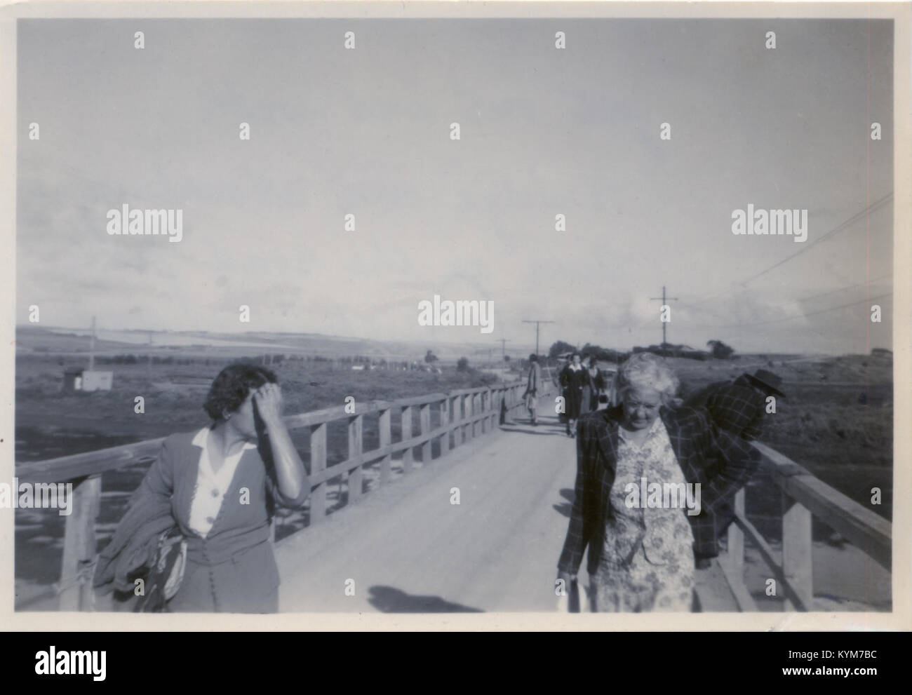 A photograph from 1948 showing a scene of people walking along the ...